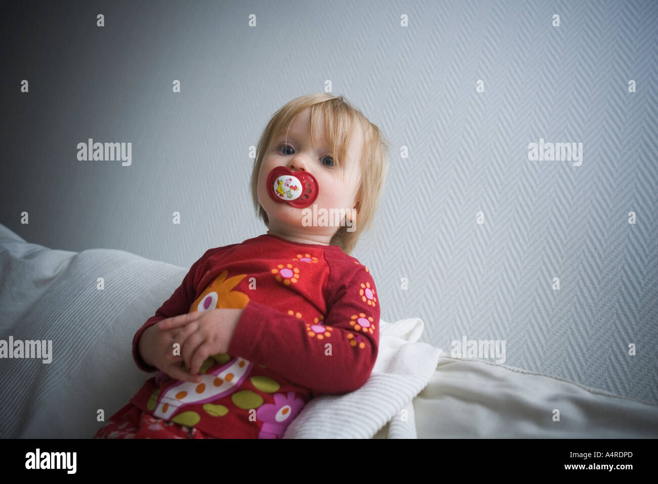 Girl with a pacifier Stock Photo - Alamy