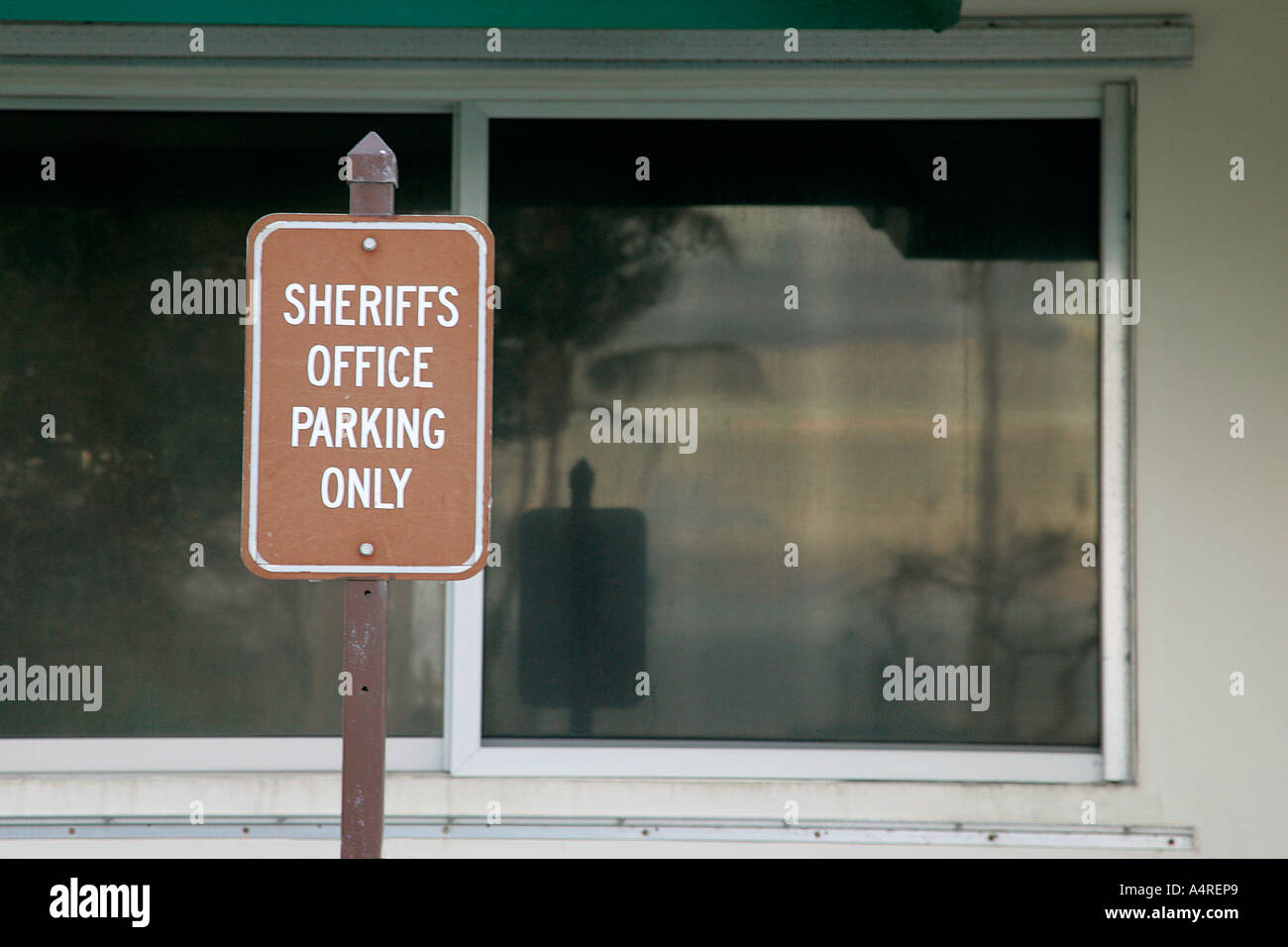 sheriffs office parking only traffic sign brown rectangle information ...