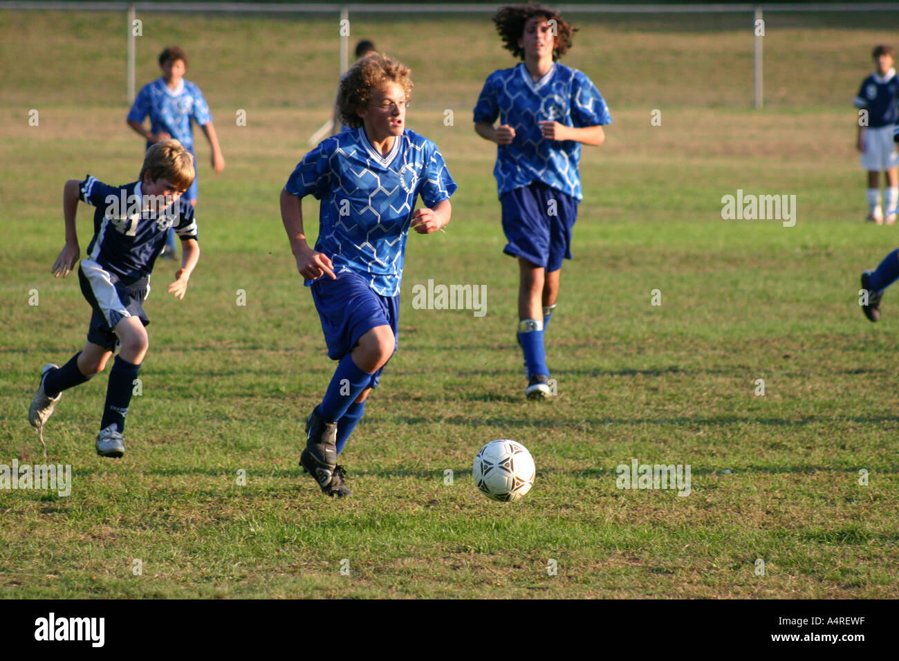 Soccer players driving to goal Stock Photo - Alamy