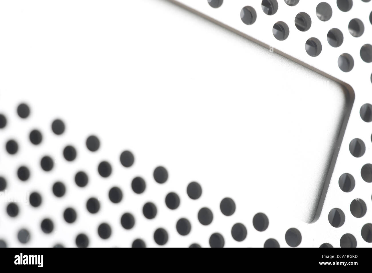 Close up of a perforated metal surface Stock Photo - Alamy