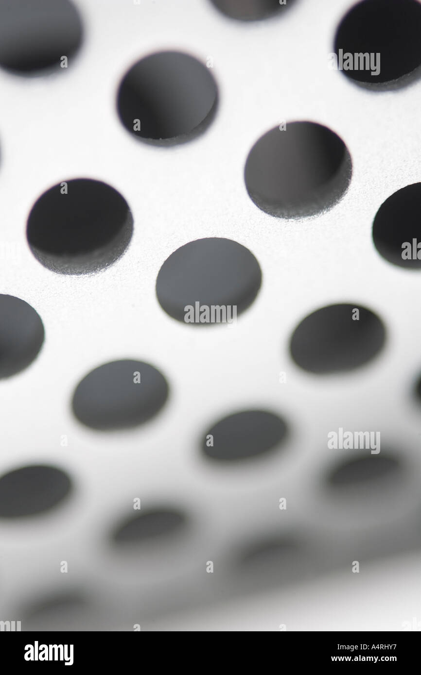 Close up of a perforated metal surface Stock Photo - Alamy