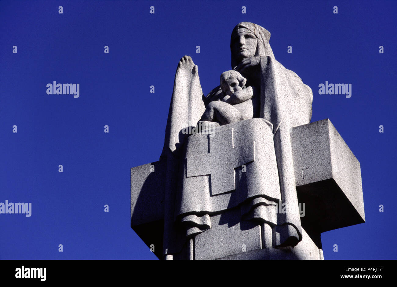 Statue of nurse and child on top of the Edith Cavell statue in St ...