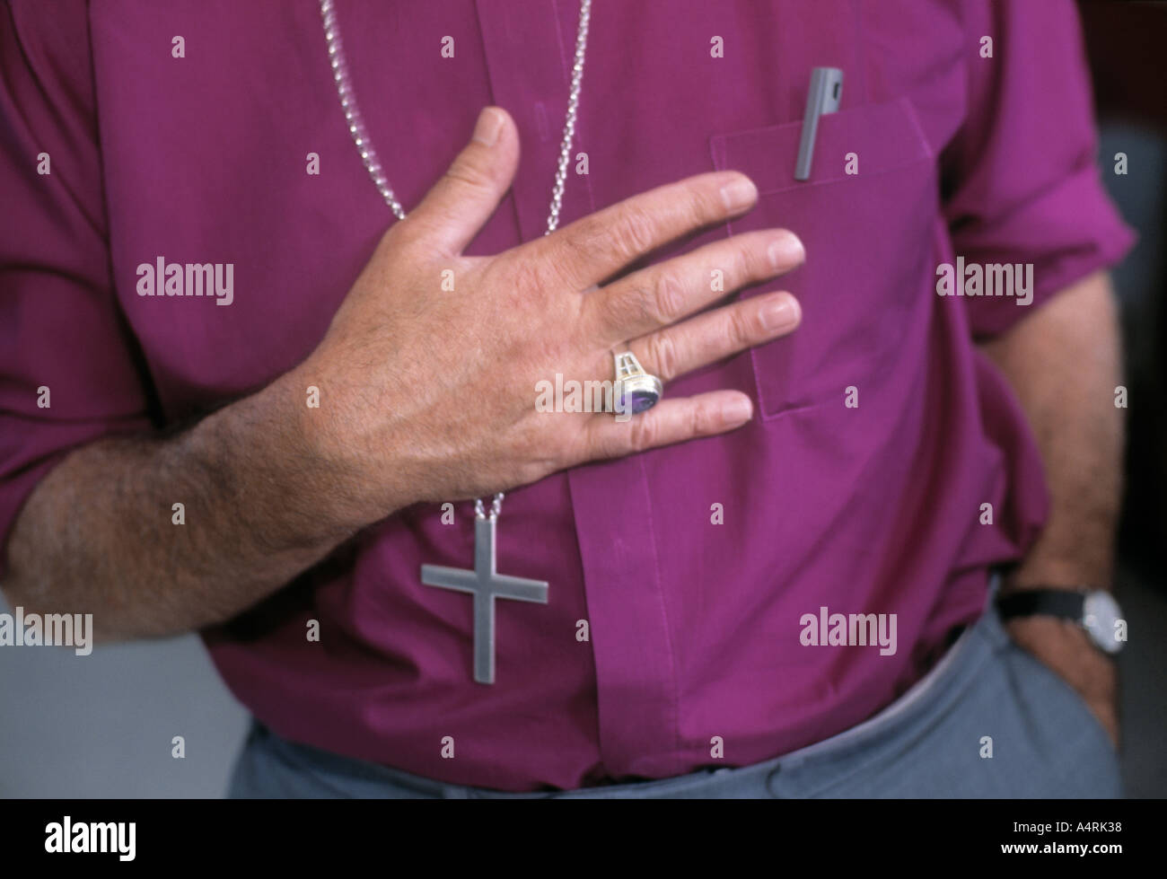 bishop with cross around neck and ring on finger Stock Photo - Alamy