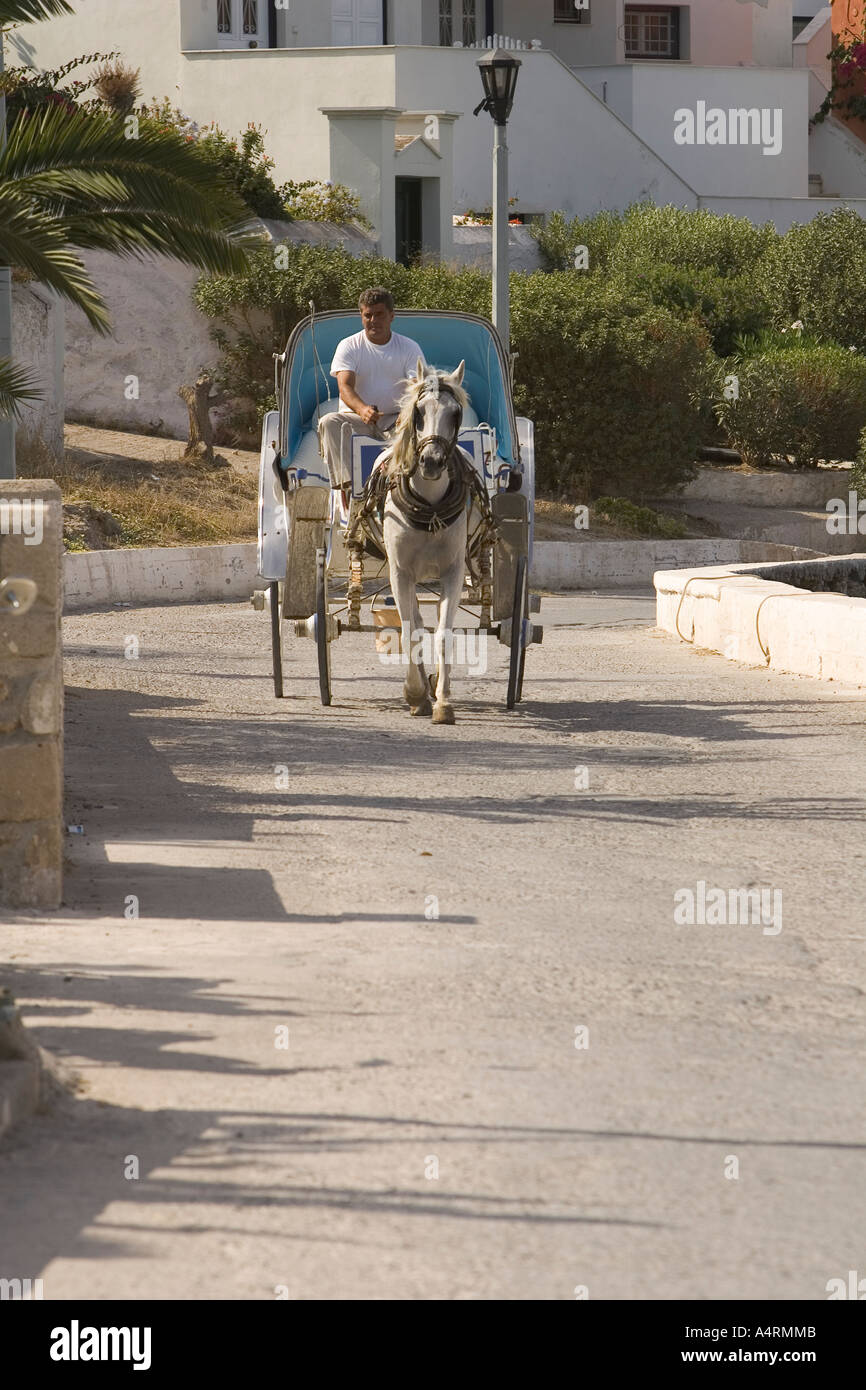 Mid adult man sitting on a carriage Stock Photo - Alamy