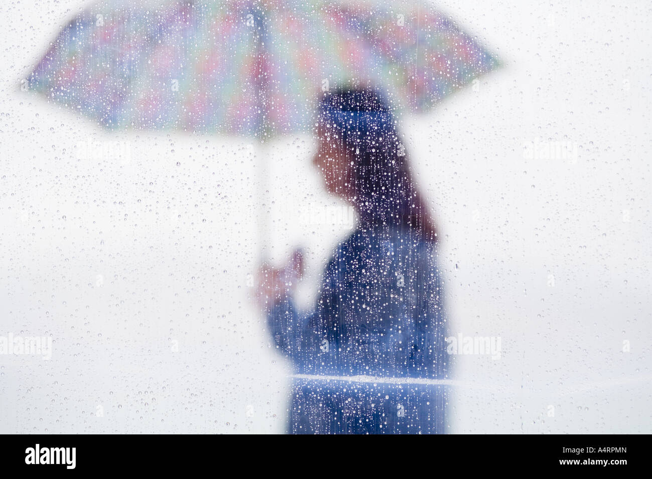 Behind woman walking rain hi-res stock photography and images - Alamy