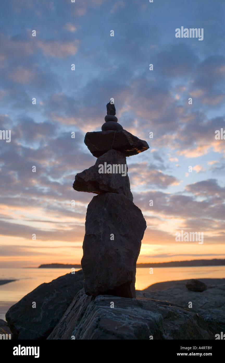 Silhouette of stack of balanced rocks at sunset with ocean Stock Photo - Alamy