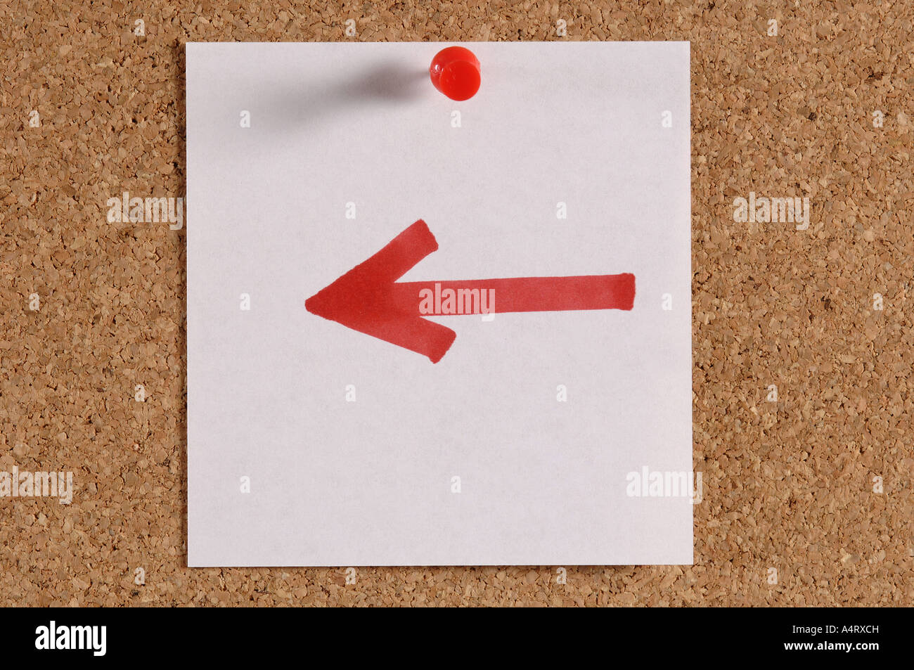 Arrow sign on a message board Stock Photo - Alamy