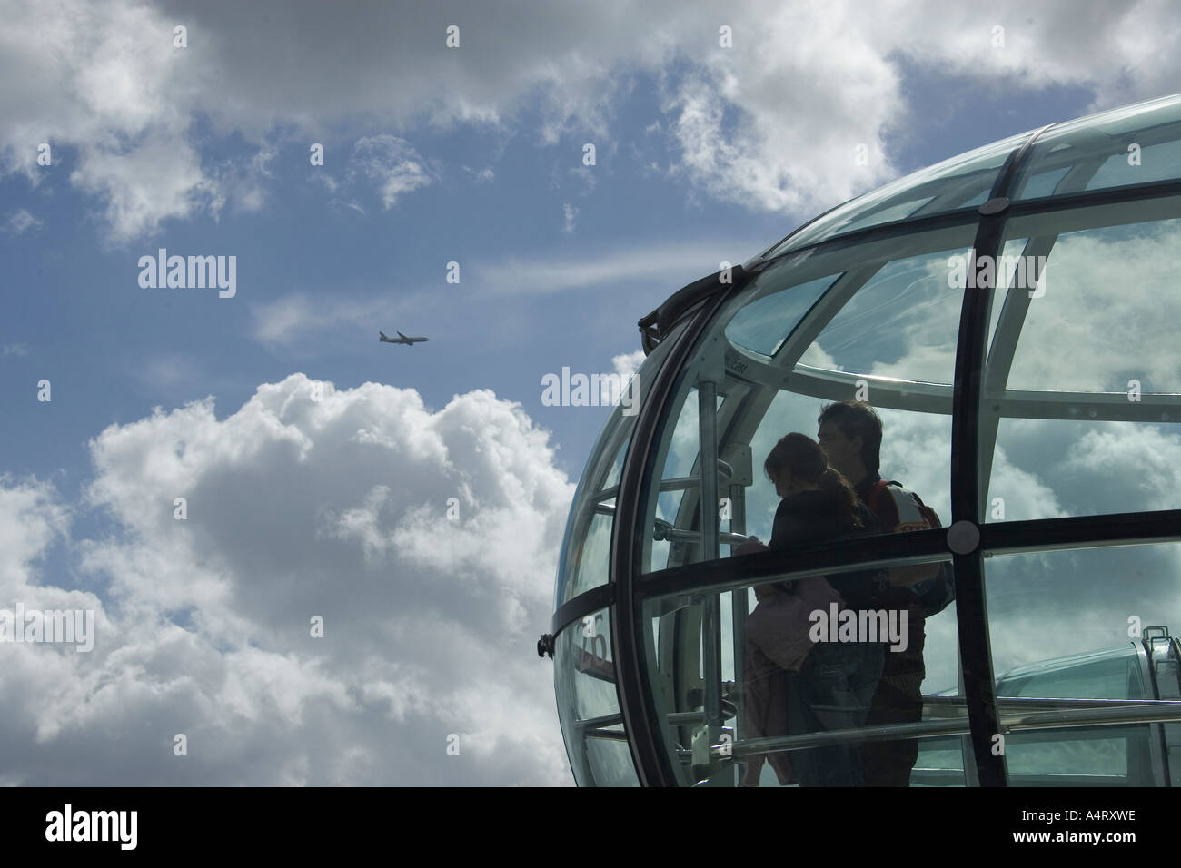 Couple inside a ferris wheel Stock Photo - Alamy