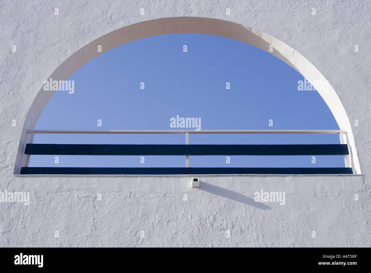 Arc on a white wall Stock Photo - Alamy