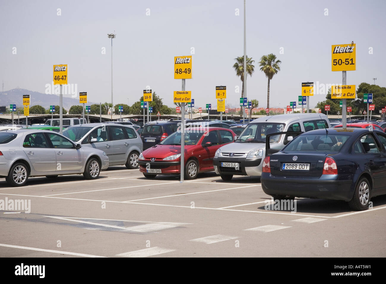Cars parked at a parking lot Stock Photo - Alamy