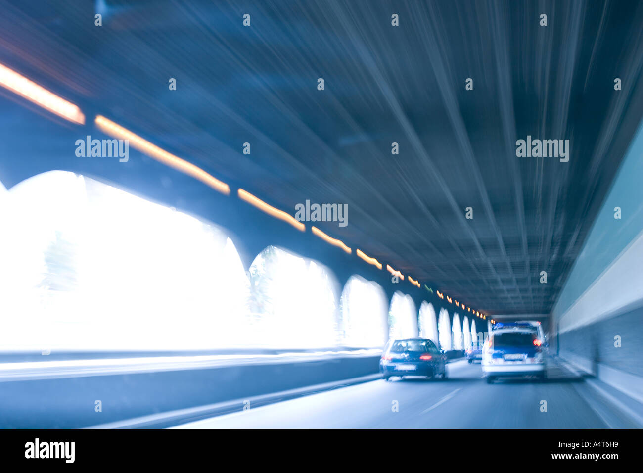 Rear view of vehicles in a tunnel Stock Photo - Alamy