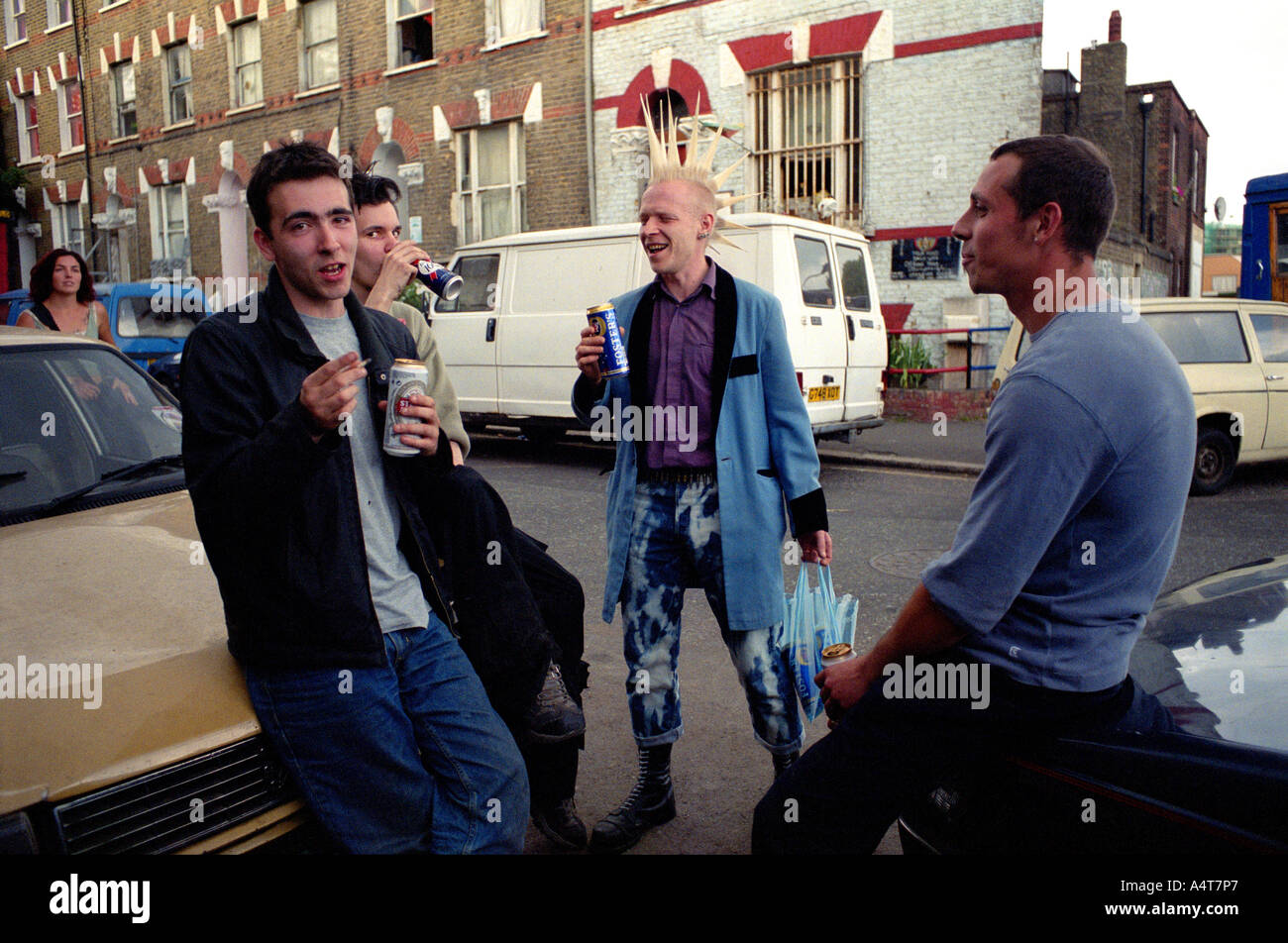 Youth hanging around relaxing and drinking at street party at St Agnes ...