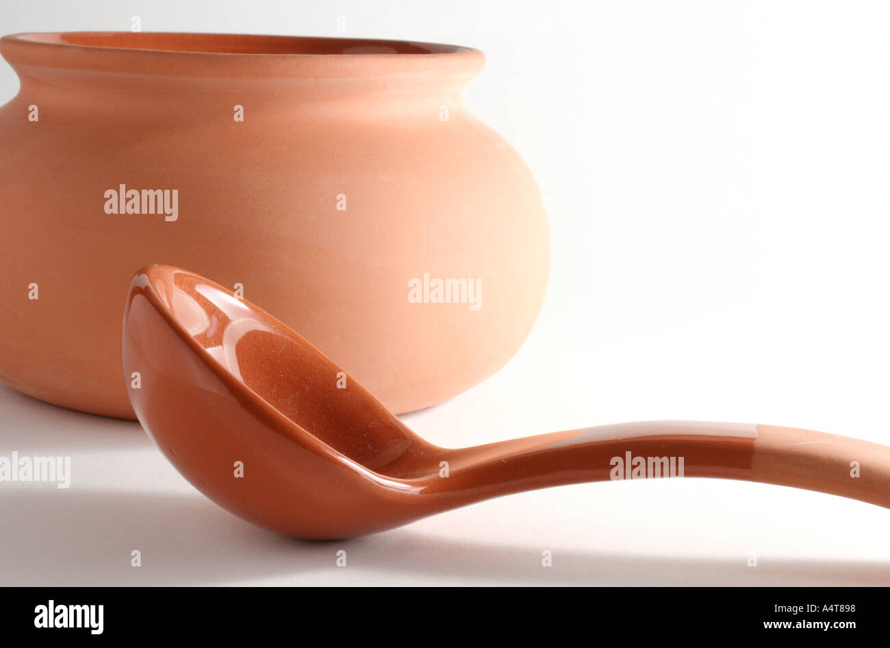 Soup Ladle and Clay Pot Stock Photo - Alamy