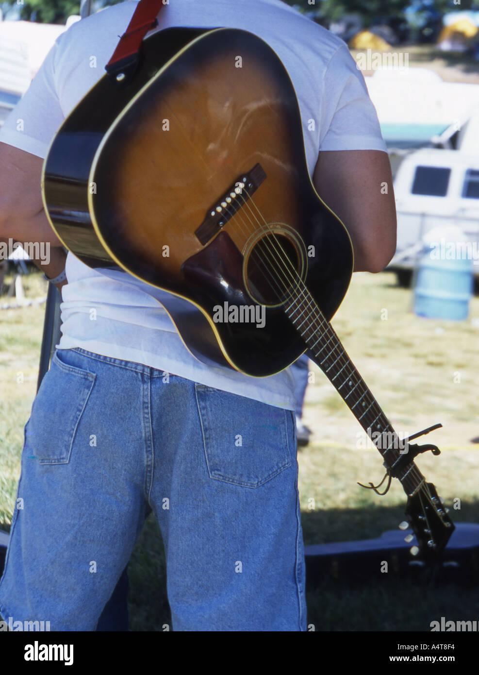 Guitar slung on back hi-res stock photography and images - Alamy
