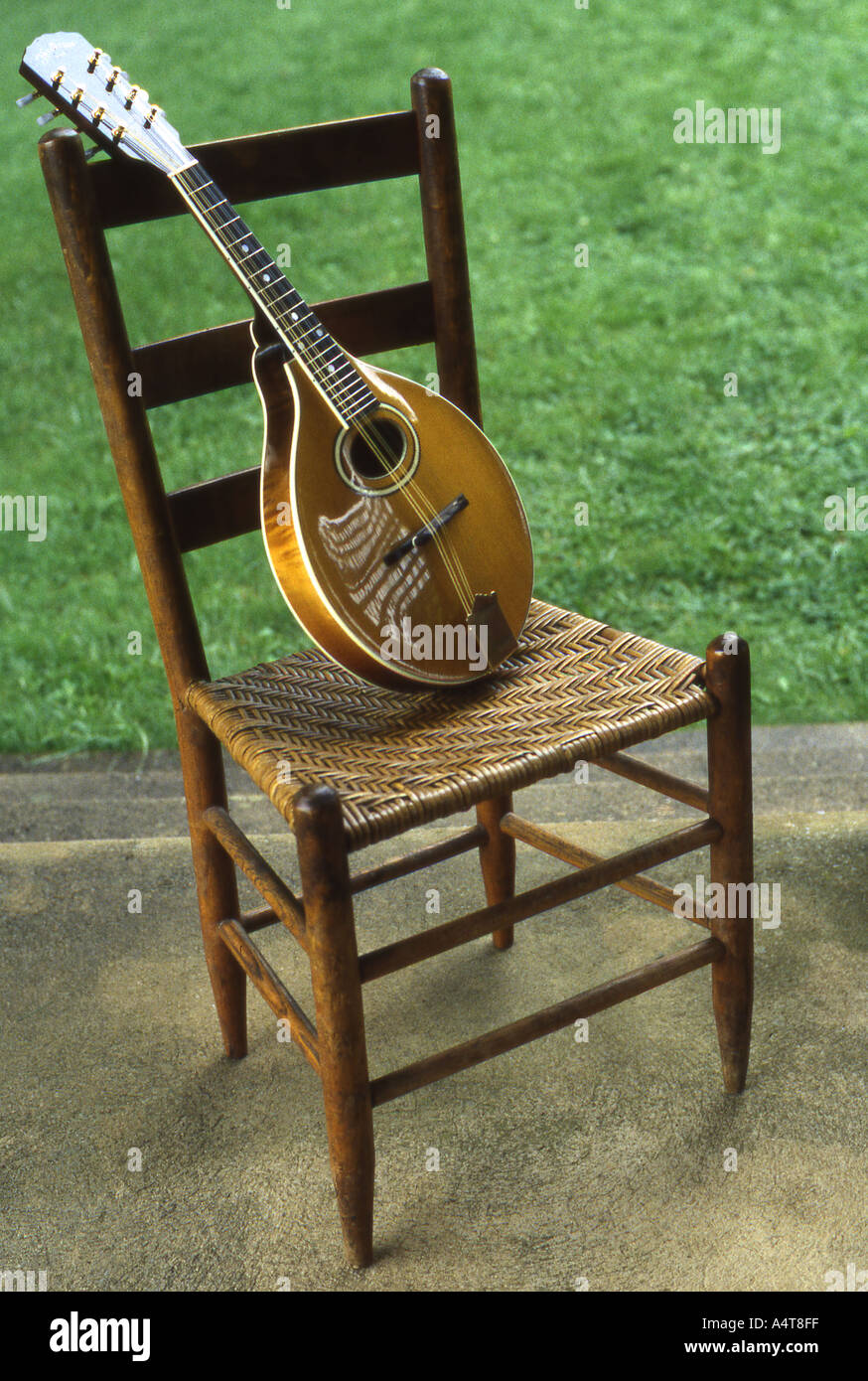 Mandolin on rustic chair hi-res stock photography and images - Alamy