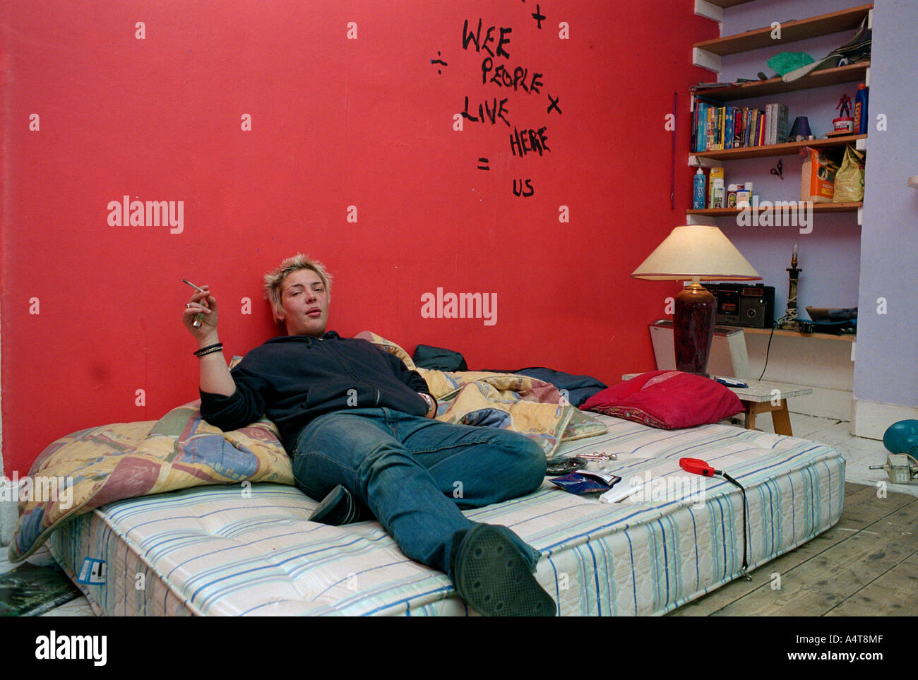 Young woman smoking bed hi-res stock photography and images - Alamy