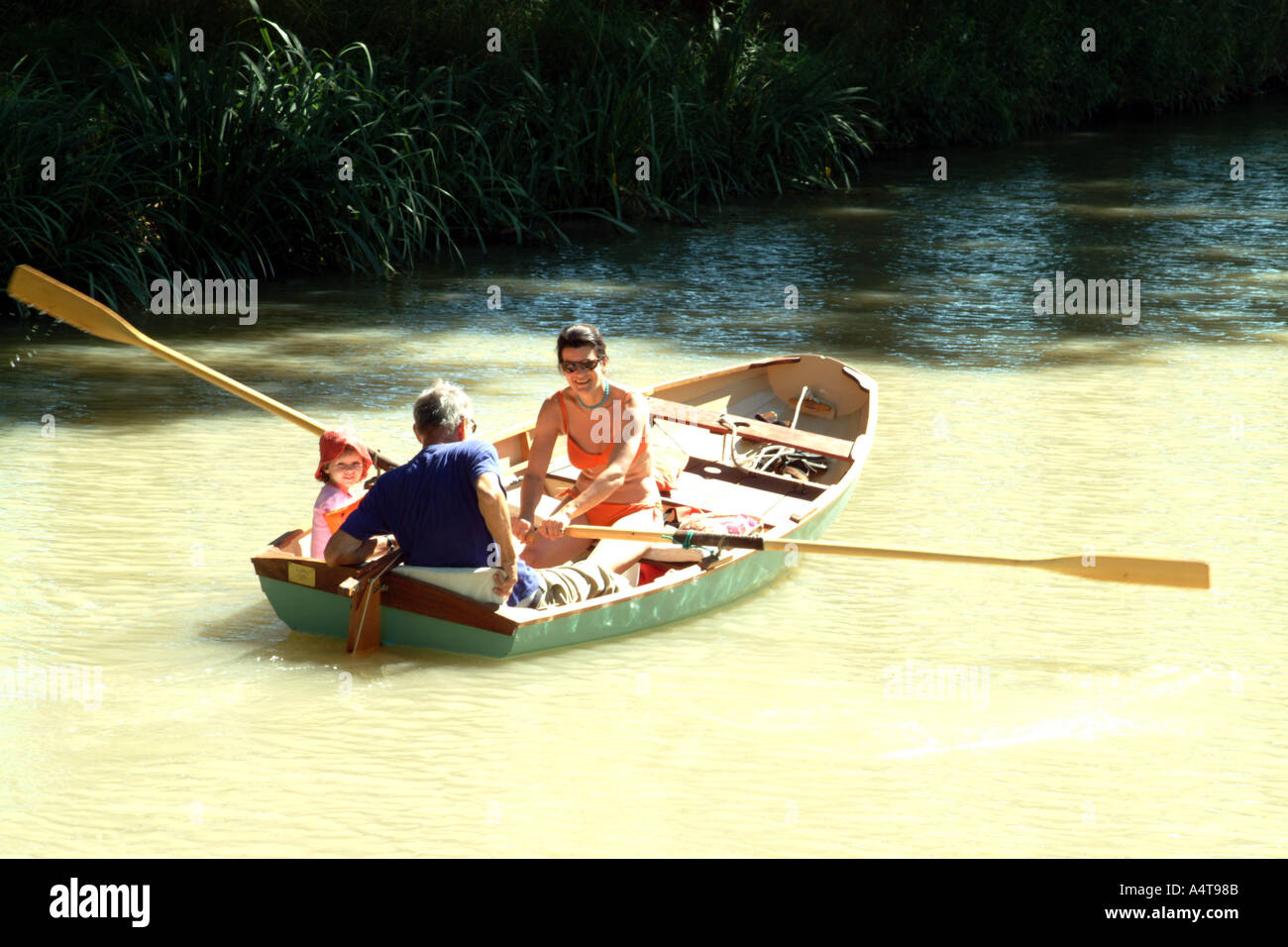 Family on row sail boat hi-res stock photography and images - Alamy