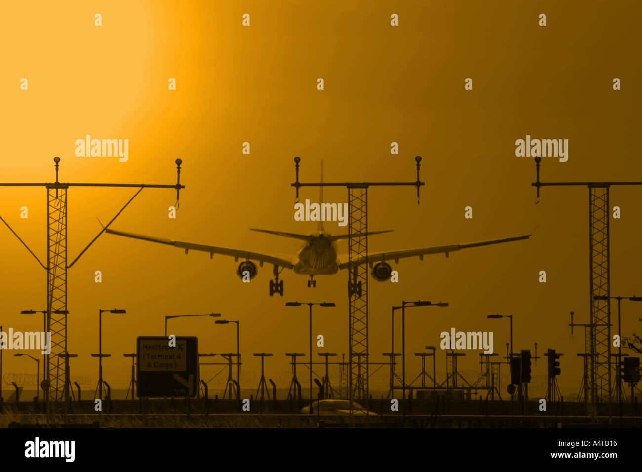 Jet airliner on final approach in the evening passing the runway ...