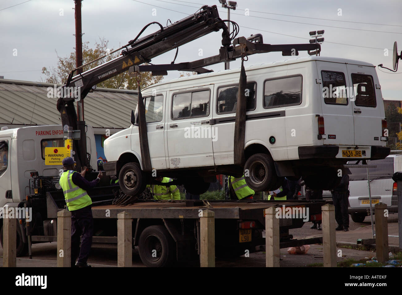 Police lifting removing and then towing away illegally parked van Stock ...