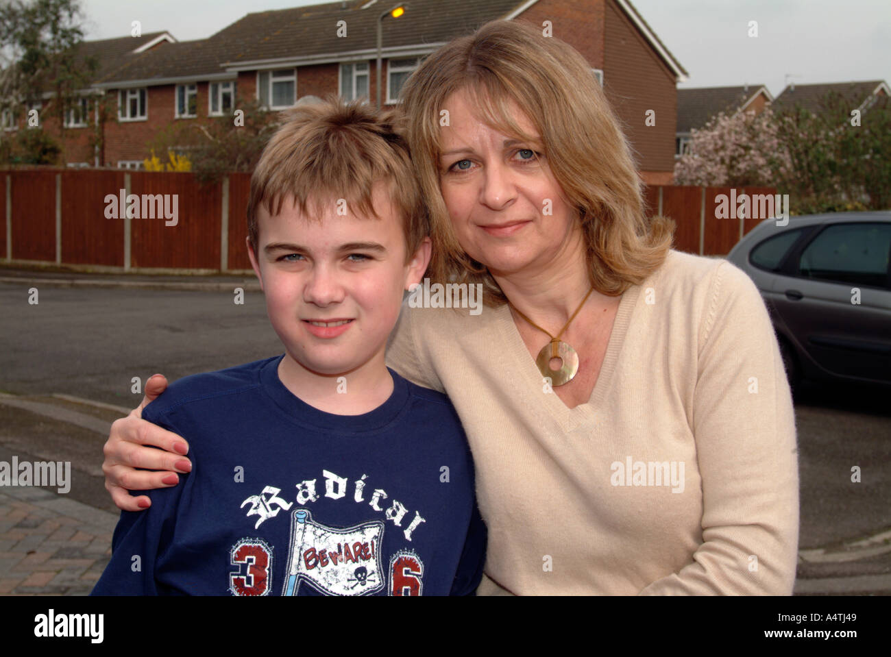 Young boy with Muscular Dystrophy with his mum Shepperton Middlesex UK ...