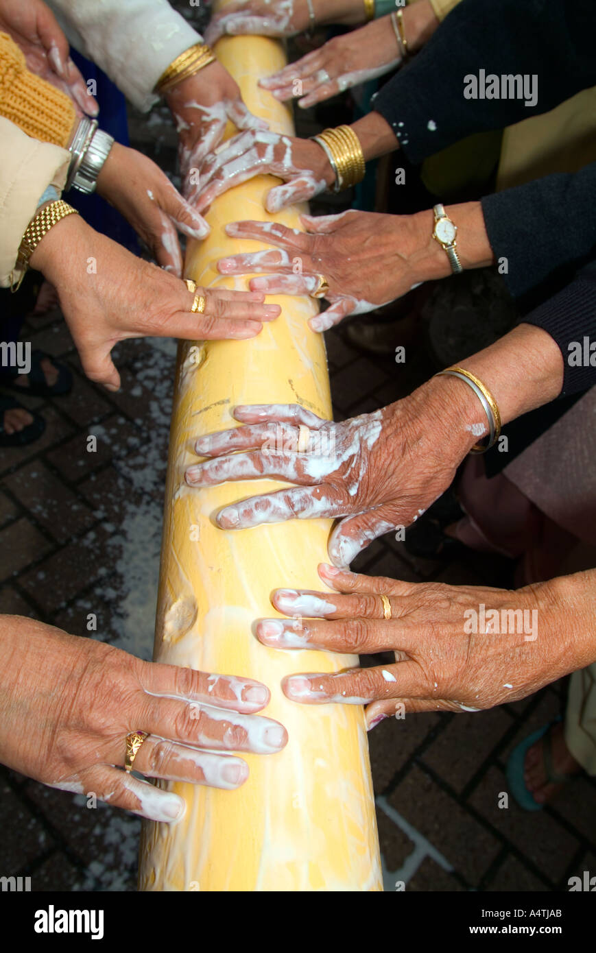 Sikh worshippers during the annual festival of Vaisakhi washing the ...