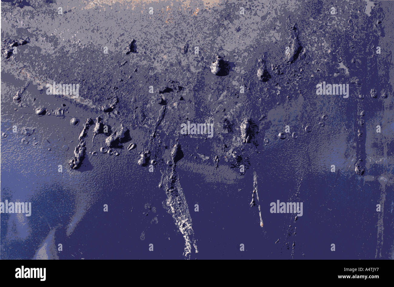 a burnt vehicle panel showing unusual patterns and textures and colours ...