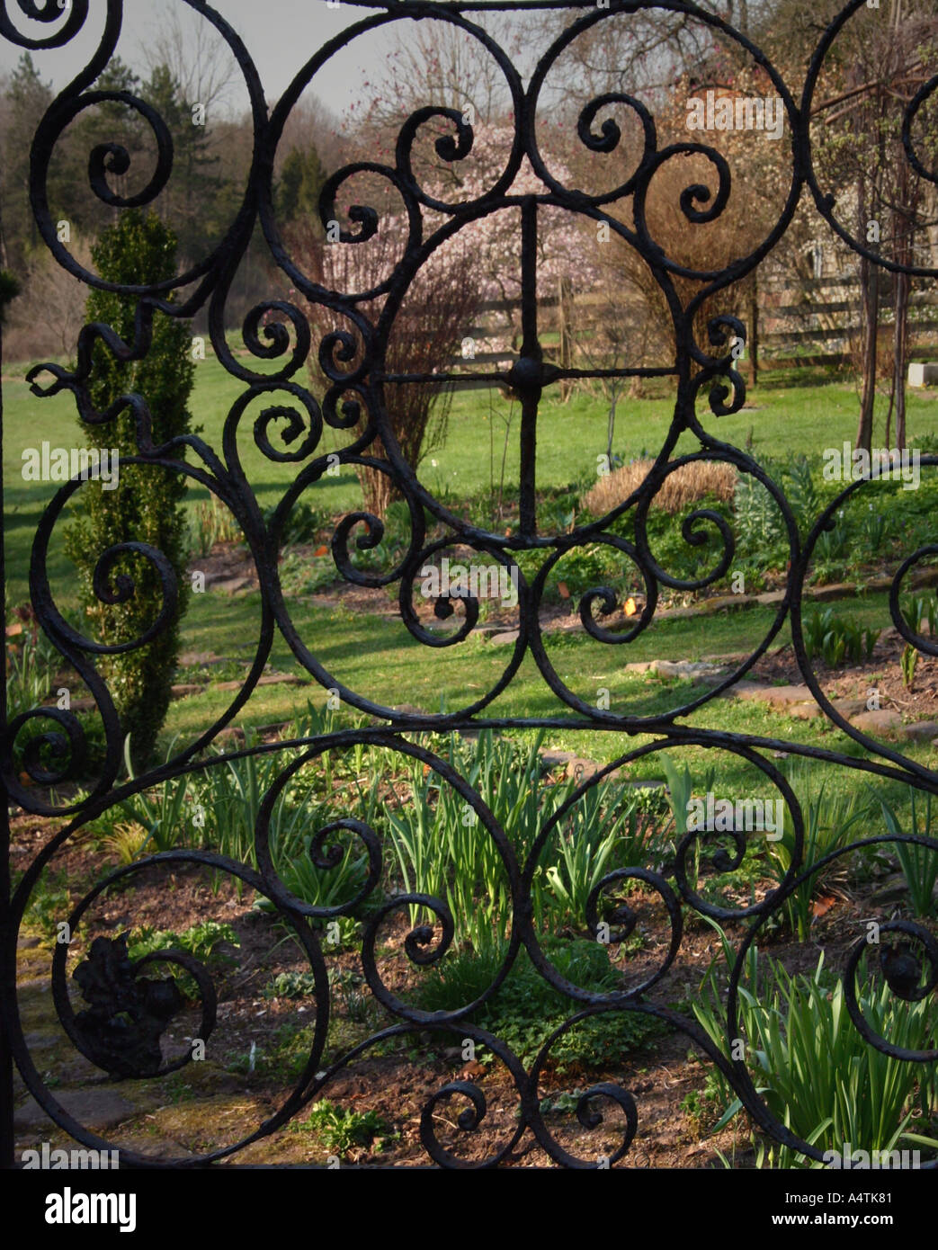 Through the garden gate in the spring Stock Photo - Alamy