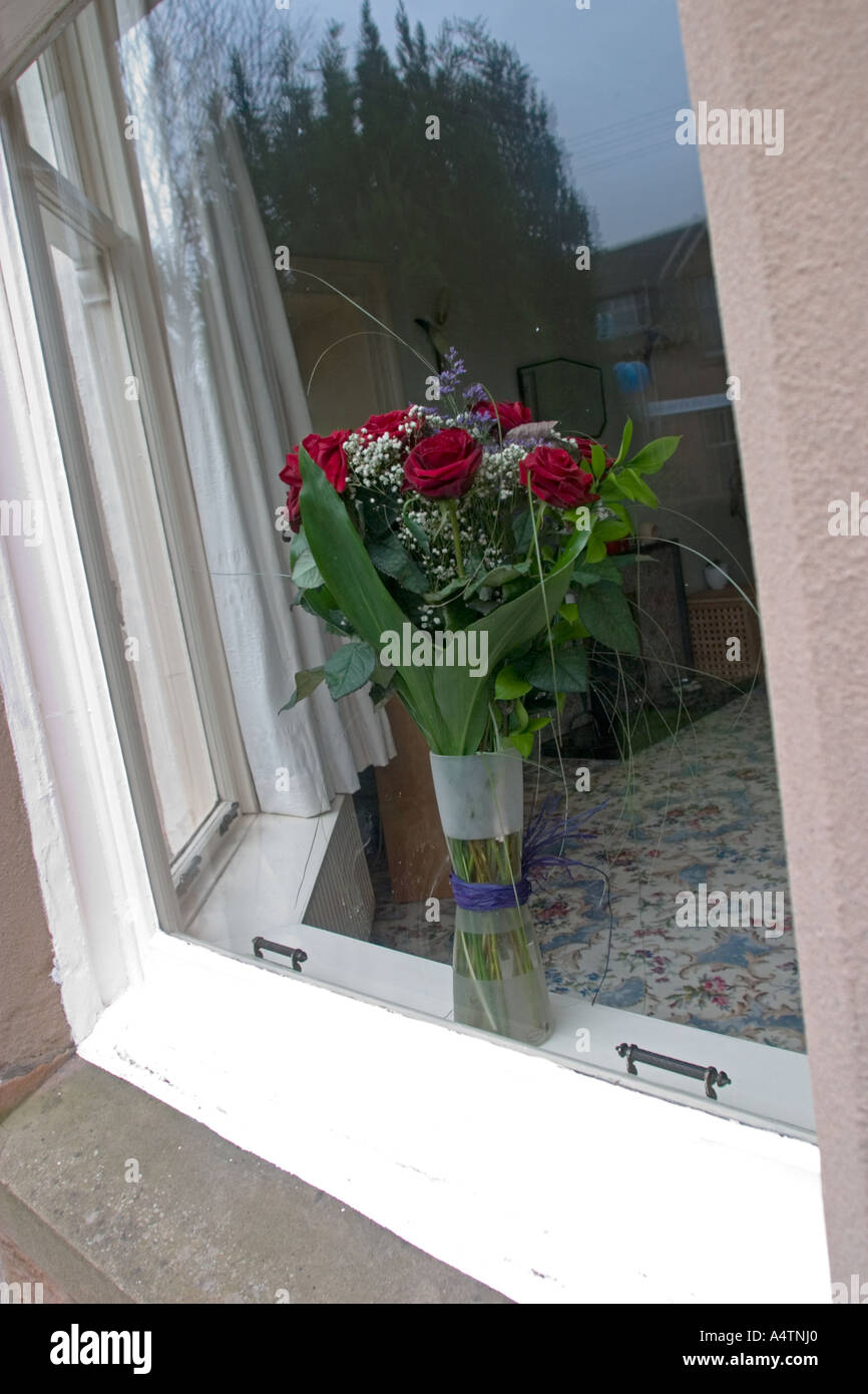 Bunches of colorful fresh roses in red, orange and lilac for sale at a ...