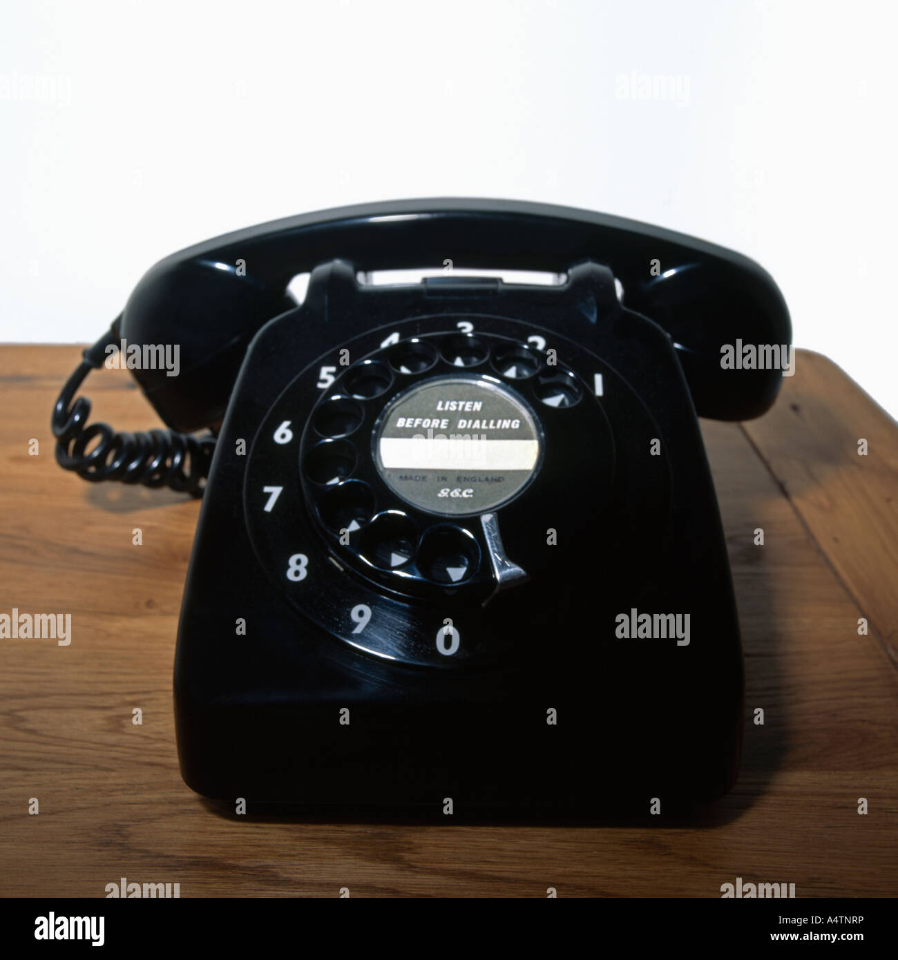 Old-fashioned black sixties telephone Stock Photo - Alamy