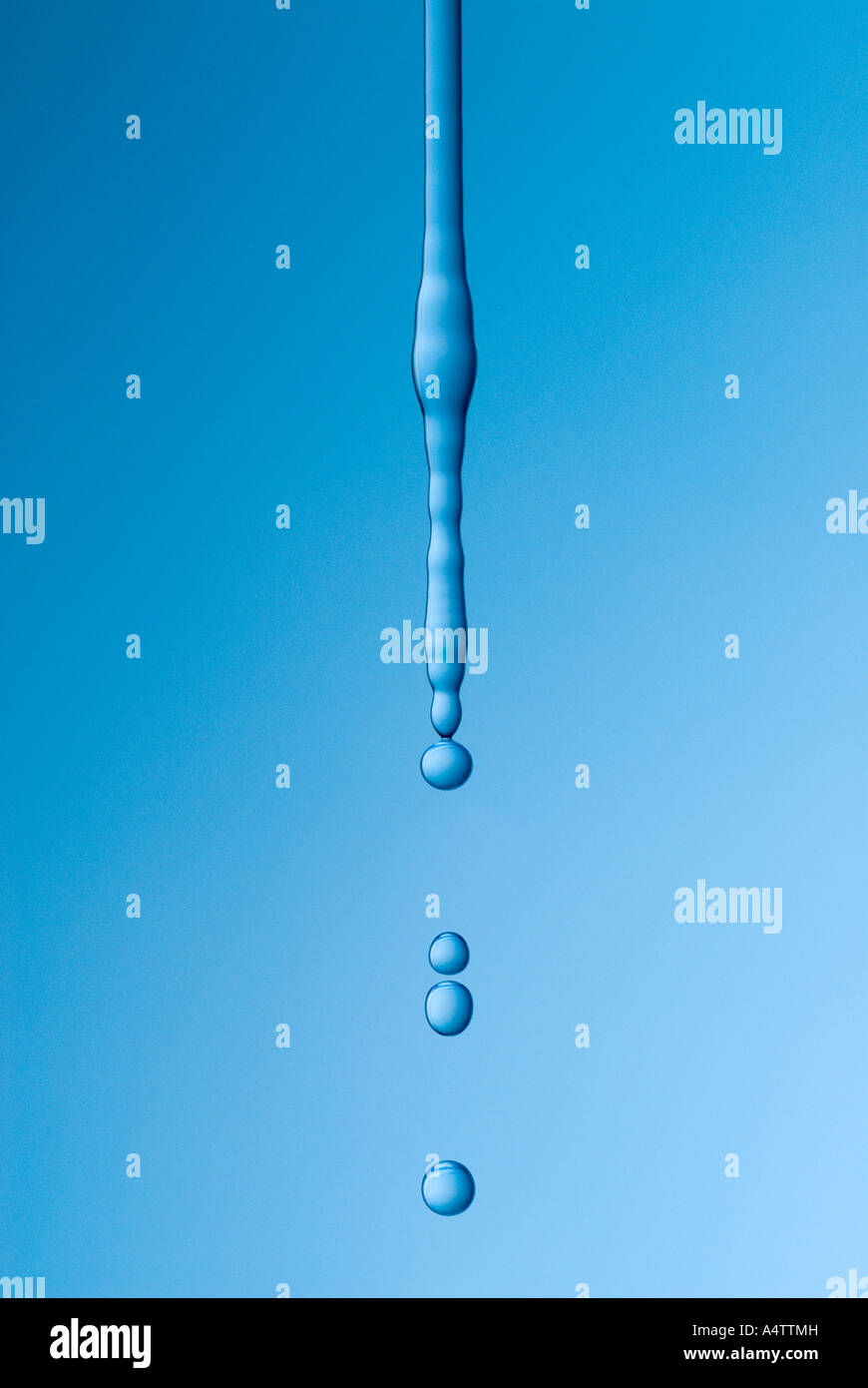 blue water drops falling in front of a blue and white background Stock ...