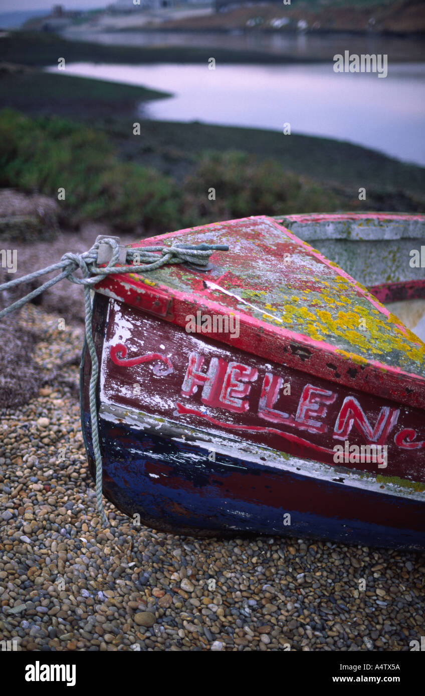 Old wooden boat on Chesil Beach named Helen in Dorset county England UK ...
