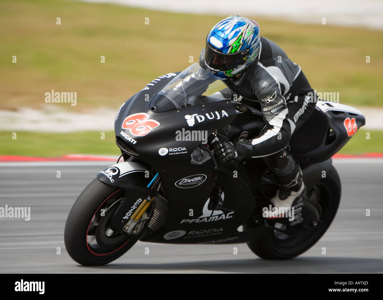 MotoGP rider Alex Hofmann racing at the Sepang International Circuit ...