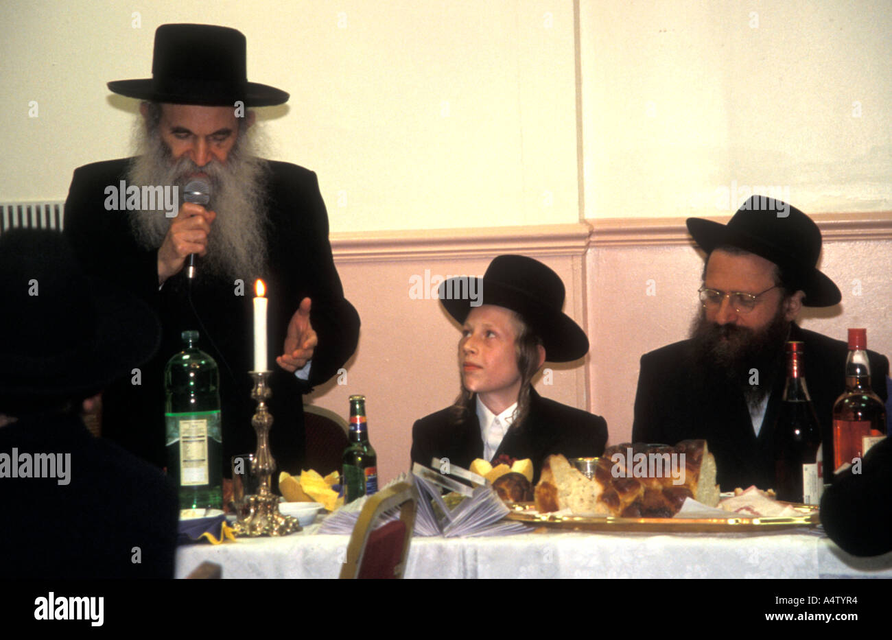 Rabbi making a speech at the celebration dinner for an Orthodox Jewish ...