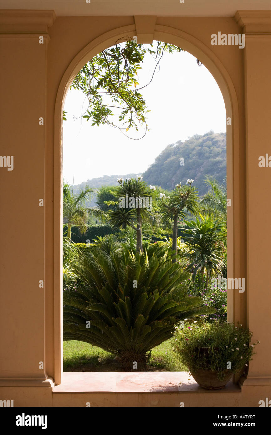View of garden through arched window Stock Photo - Alamy
