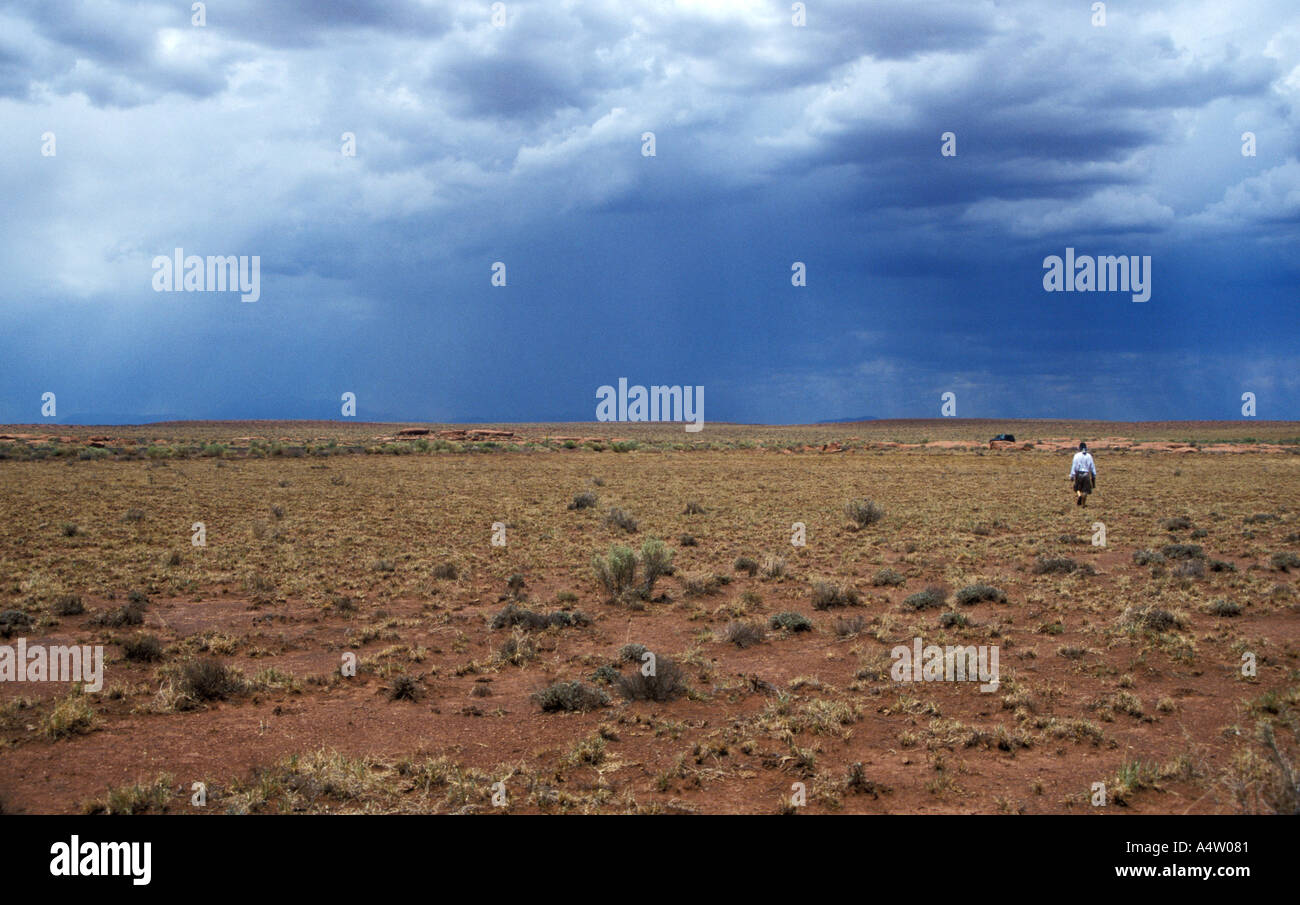 A lone figure walking in Arizona wilderness Stock Photo - Alamy