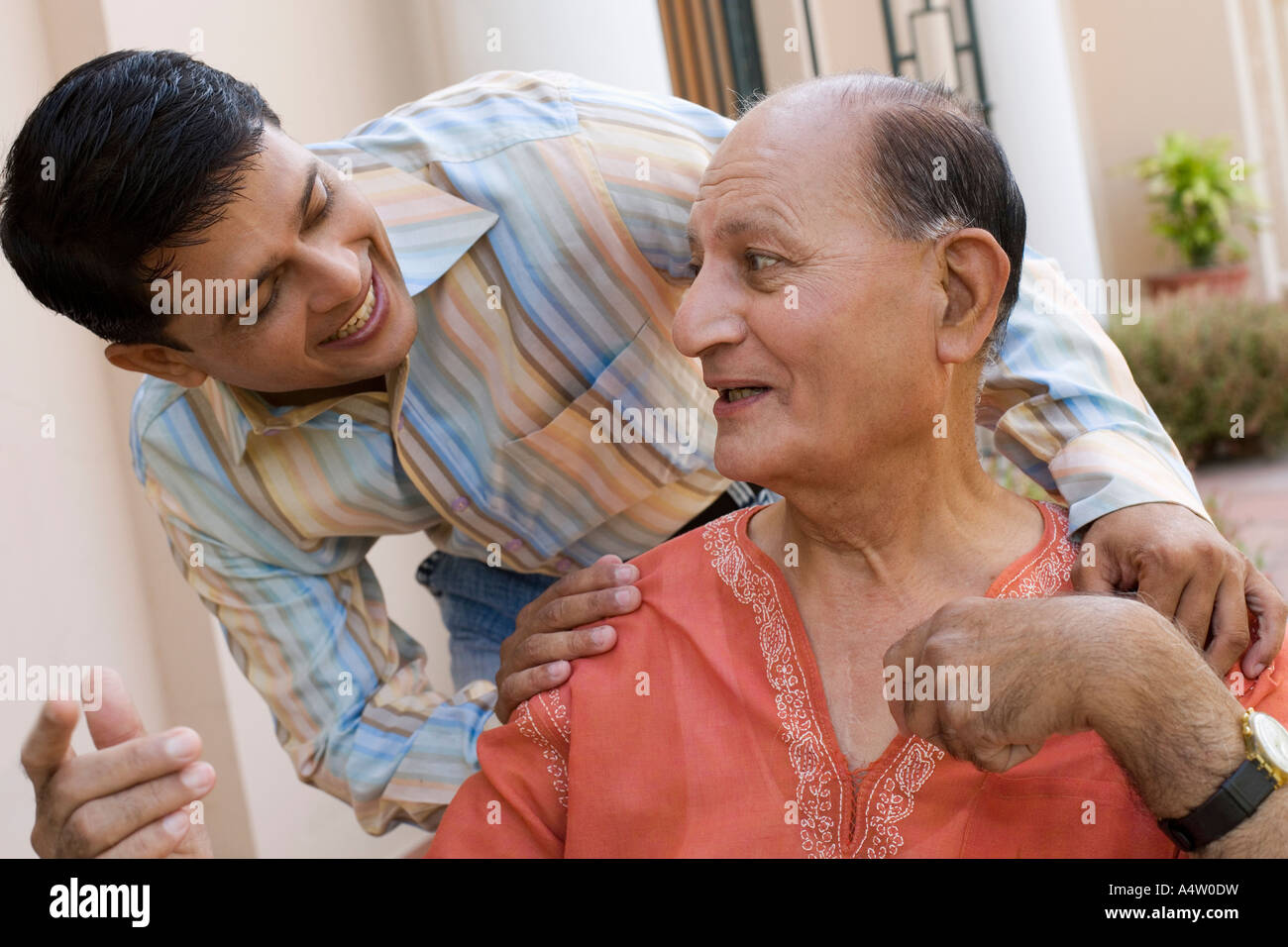 Man talking to his father Stock Photo - Alamy