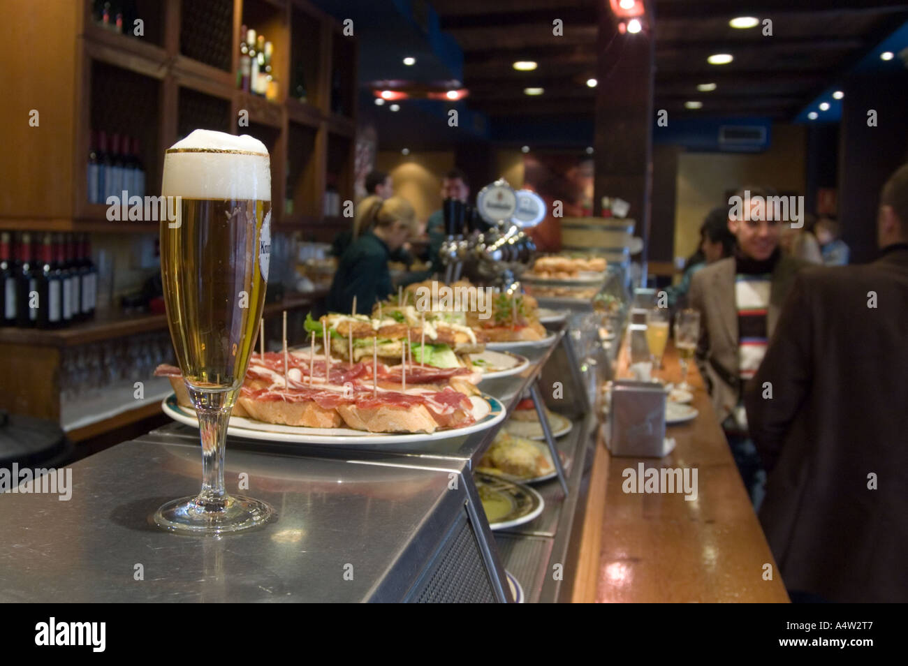 Glass of beer and plates of pinchos in a Basque bar in Barcelona Spain ...