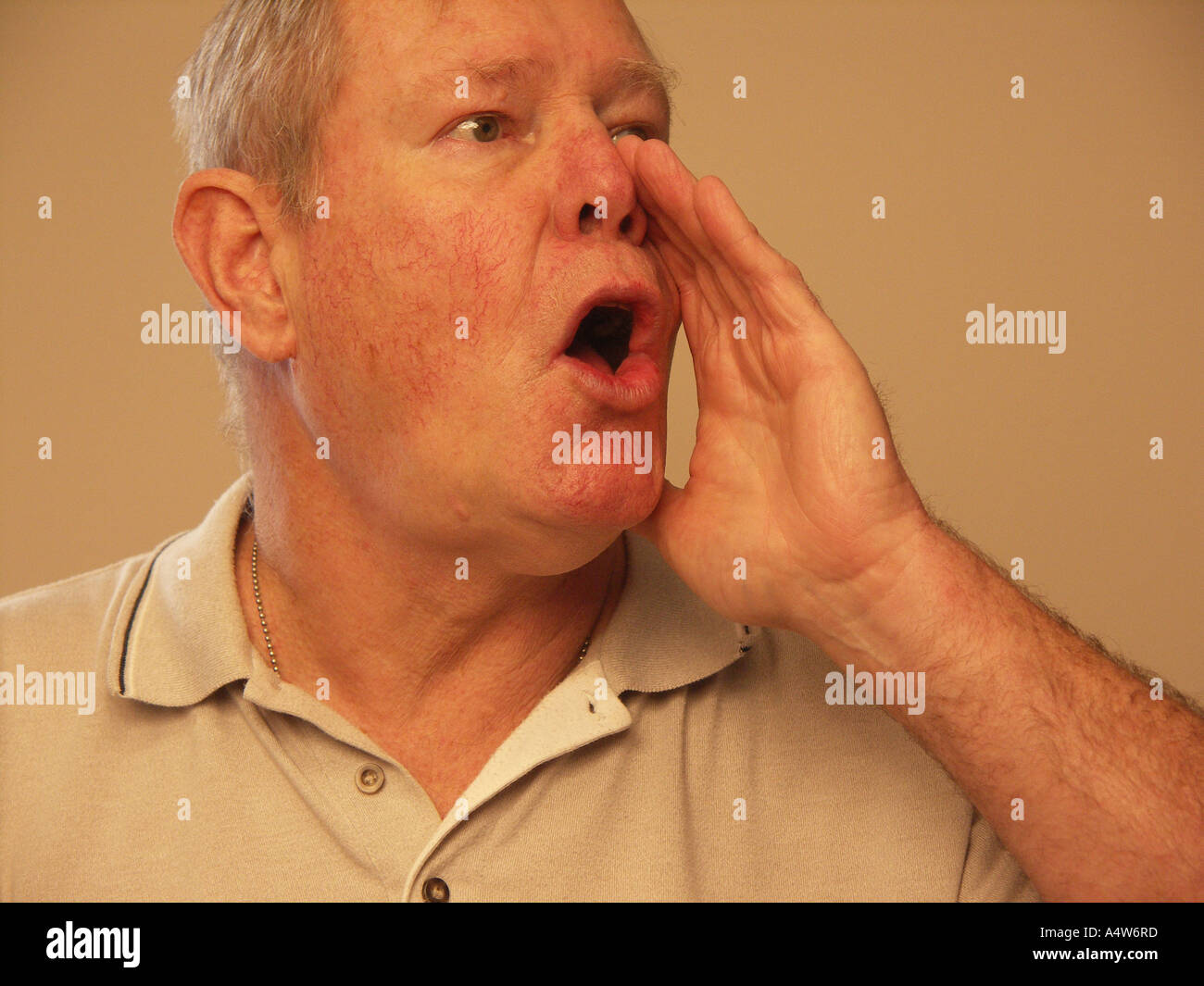 Man calling hand on mouth hi-res stock photography and images - Alamy