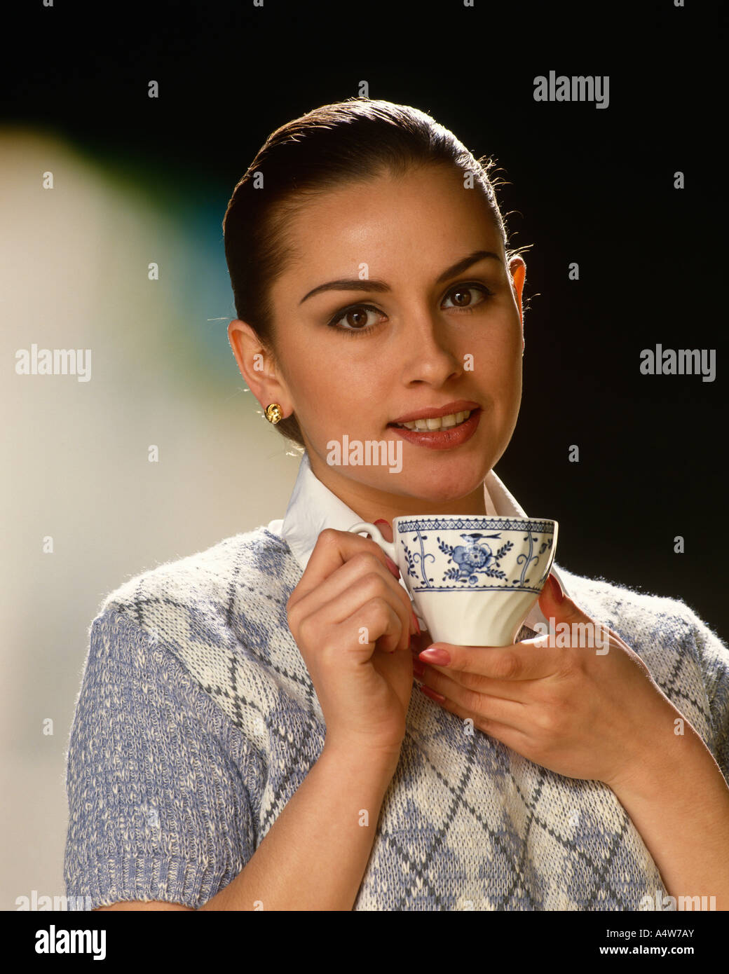 LISA BANGERT SCRAPED BACK HAIR ARGYLE SWEATER BLUE WHITE CUP Stock ...