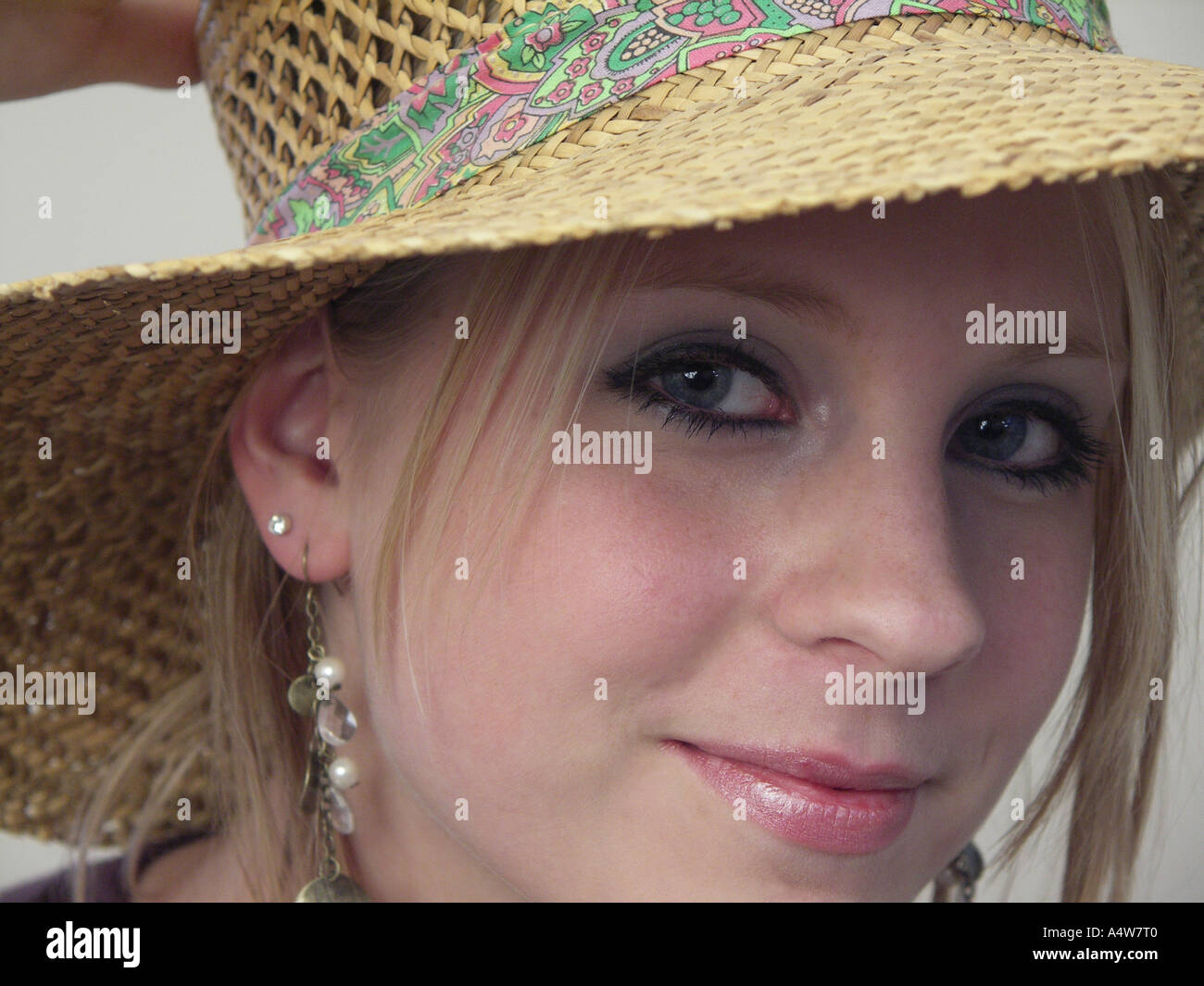 Coy smile pink hat hi-res stock photography and images - Alamy