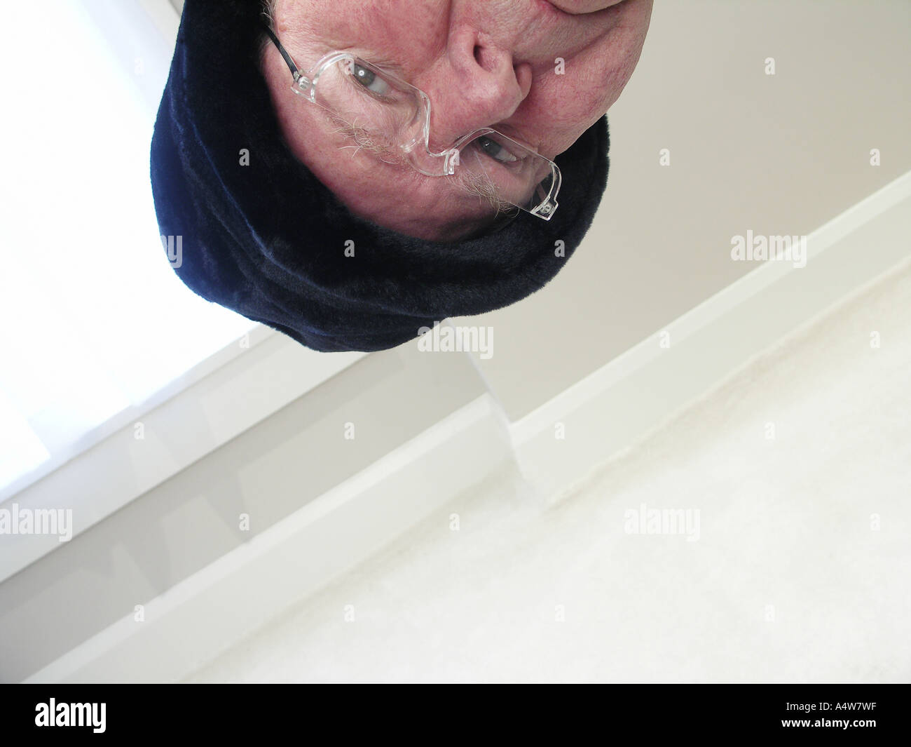 Elderly Man Peering Over the Top Stock Photo - Alamy