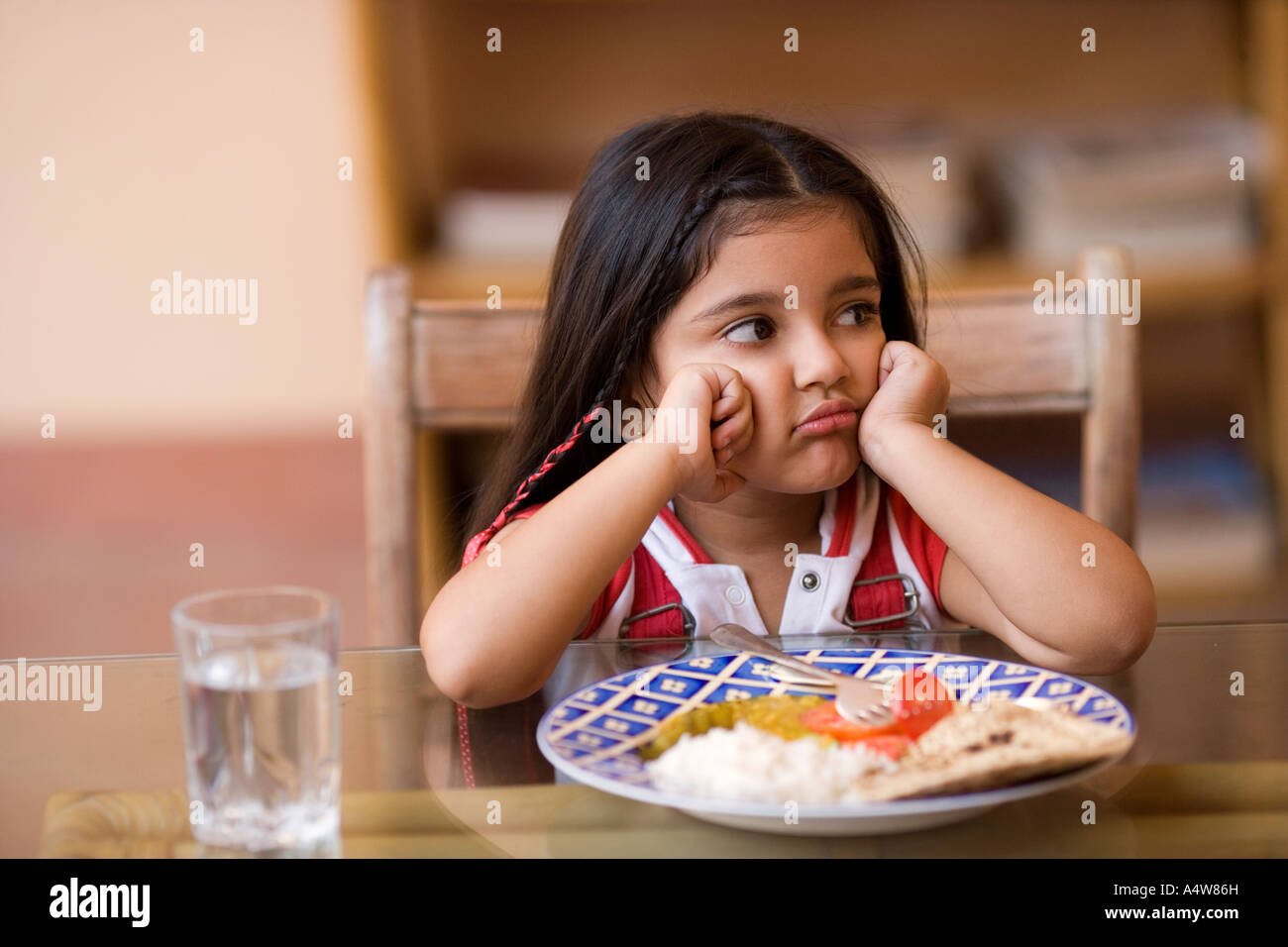 Young girl refusing to eat Stock Photo - Alamy