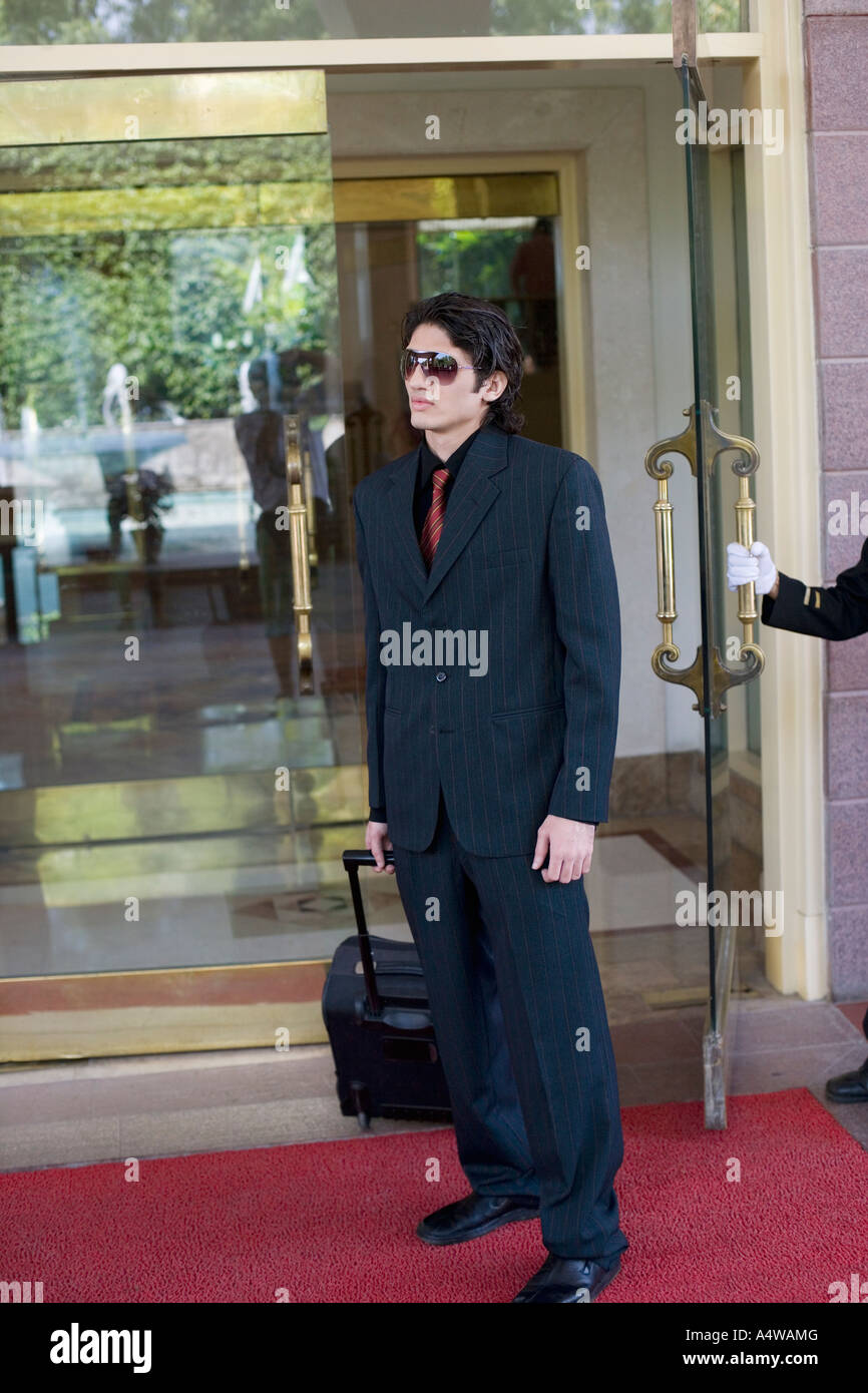 Two people walking through door hi-res stock photography and images - Alamy