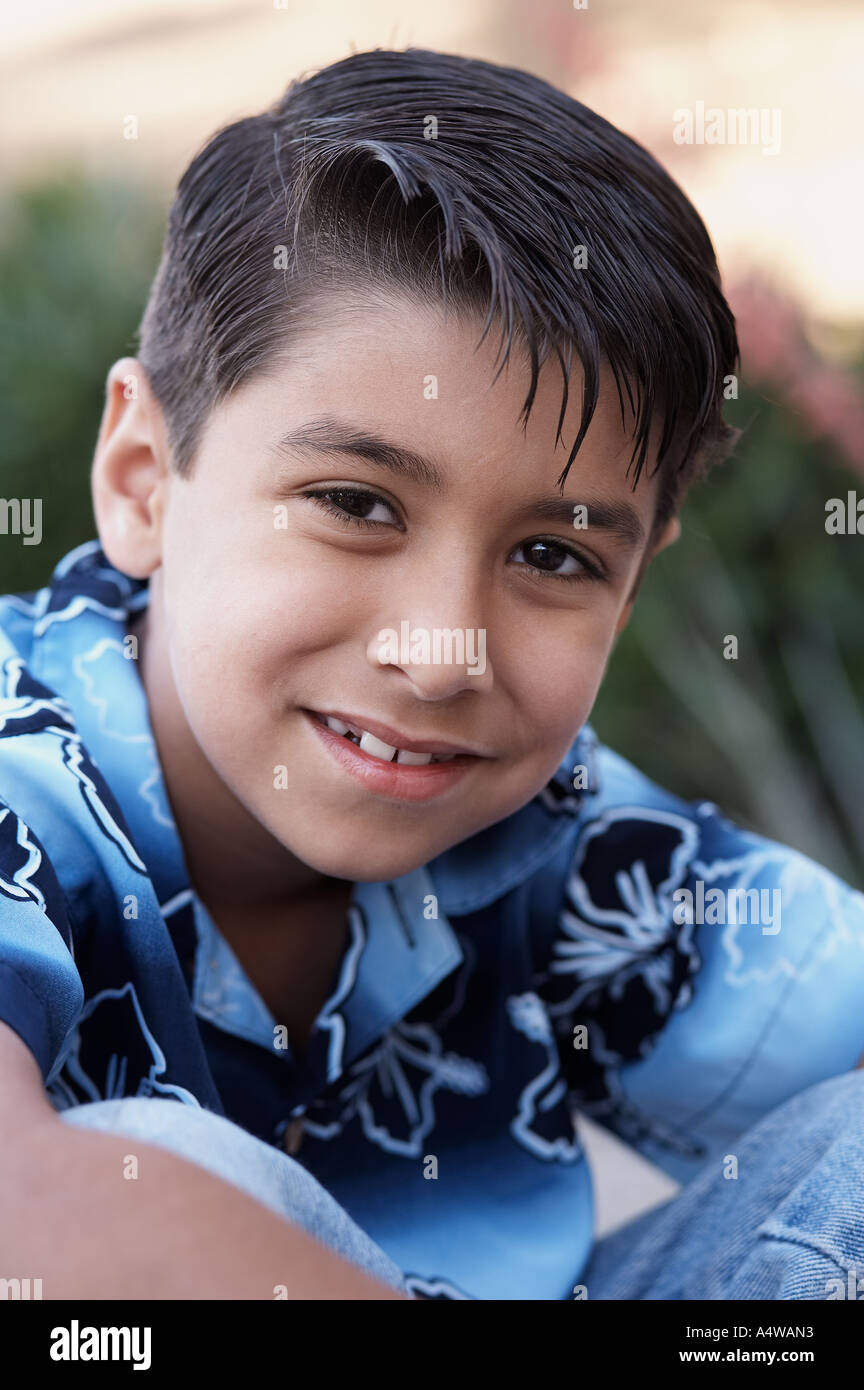 Portrait of ethnic boy smiling taken outside Stock Photo - Alamy
