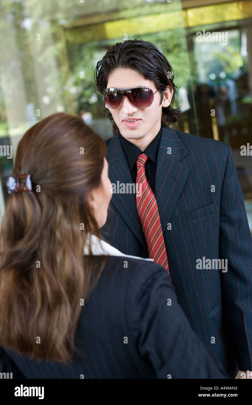Businessman talking to friend Stock Photo - Alamy