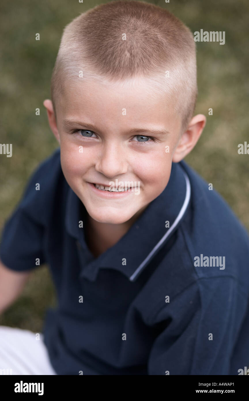 Portrait of young boy smiling taken outside Stock Photo - Alamy