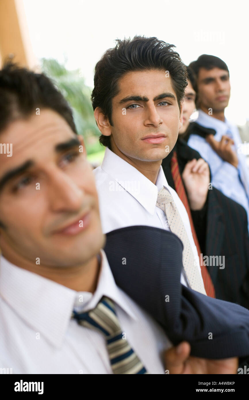 Businessmen in a row Stock Photo - Alamy