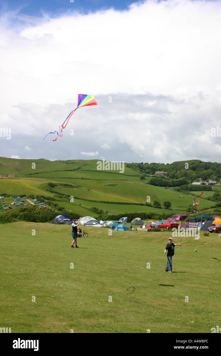 Two boys flying kites on a windy day in Dorset Stock Photo - Alamy