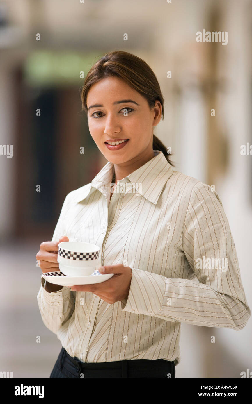 Businesswoman drinking coffee Stock Photo - Alamy