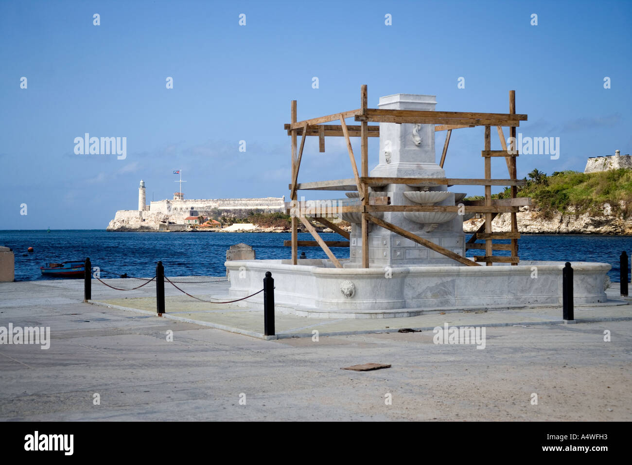 Hurricane damage to a statue on the sea front with the Castillo de Tres ...